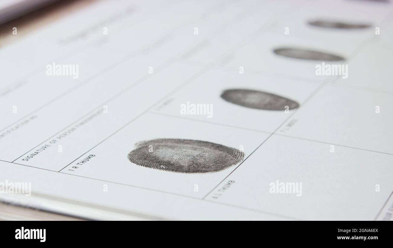 Close up macro of fingerprint registration form filling finger ink ...