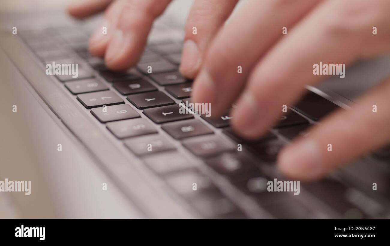 Close up macro of hands typing on laptop keyboard mac computer Stock ...