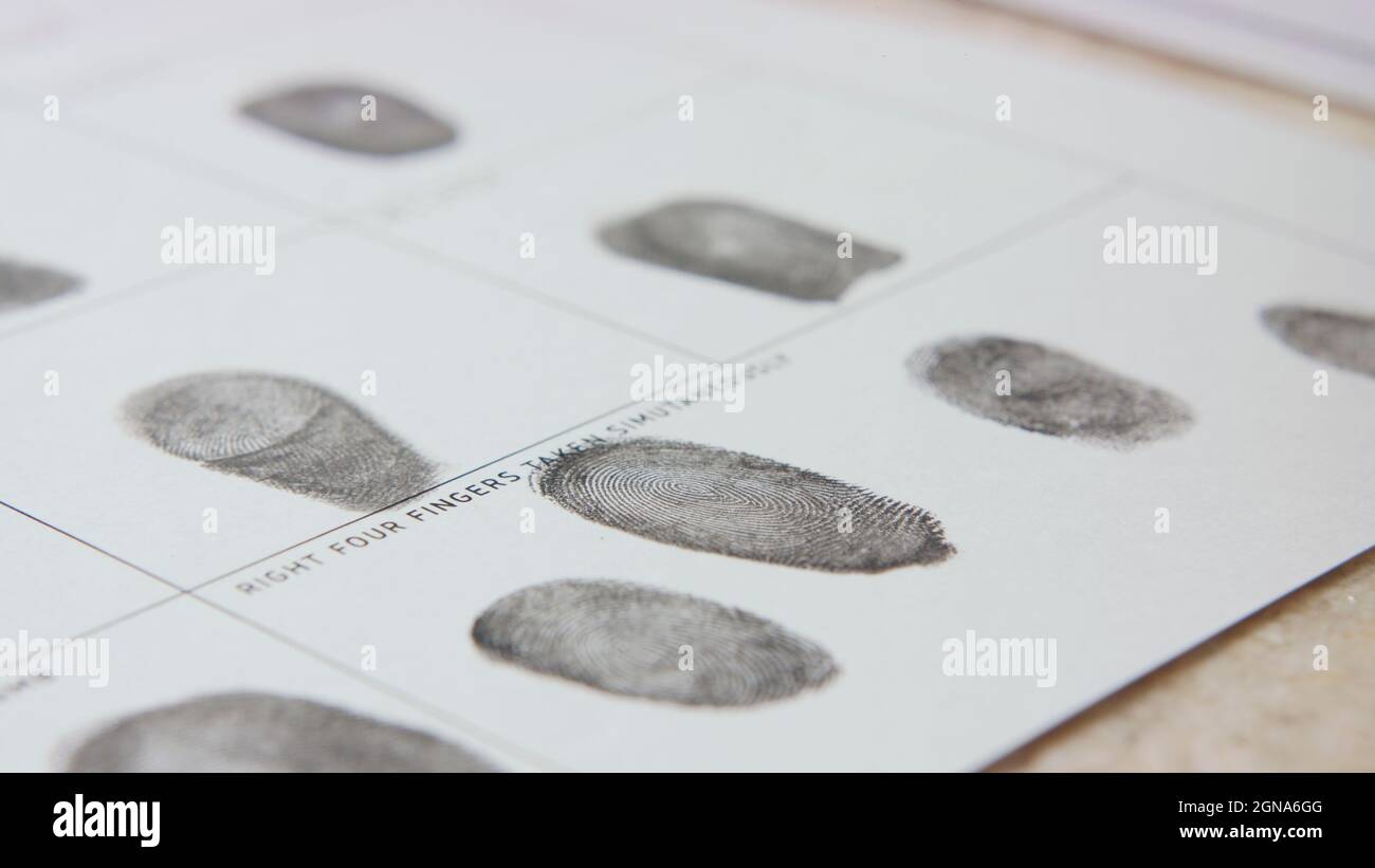 Close up macro of fingerprint registration form filling finger ink ...
