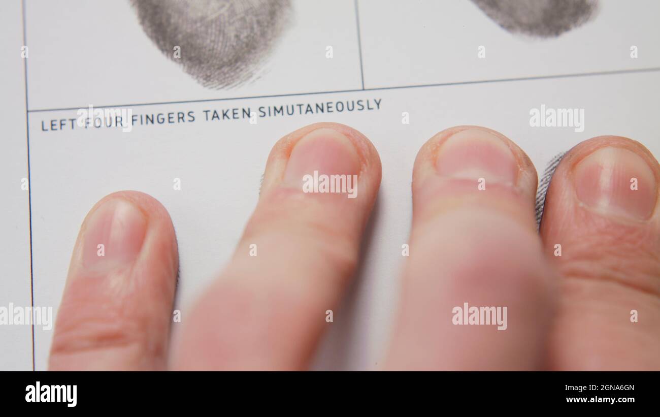 Close up macro of fingerprint registration form filling finger ink ...