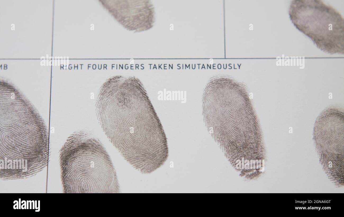 Close up macro of fingerprint registration form filling finger ink ...