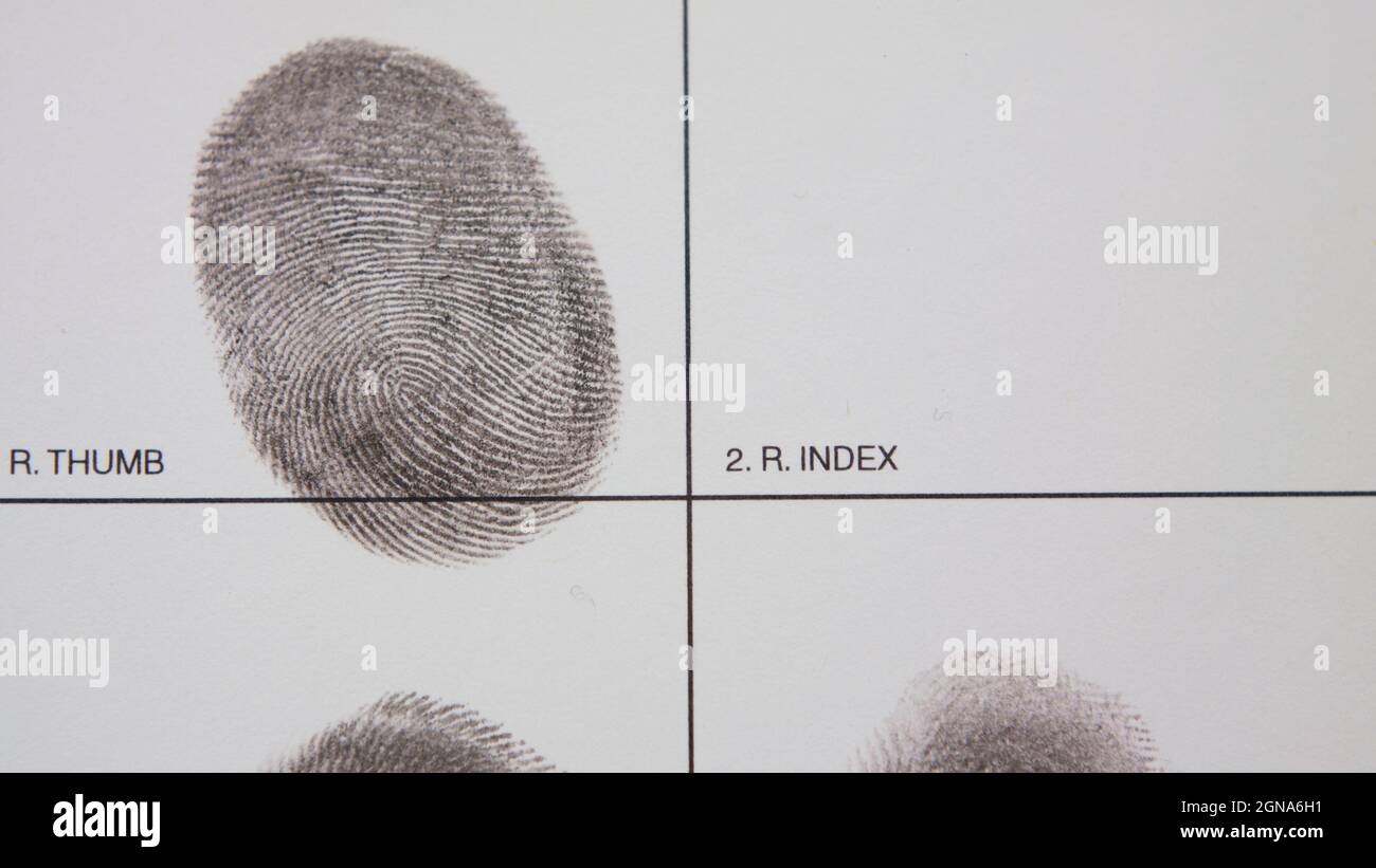 Close up macro of fingerprint registration form filling finger ink ...