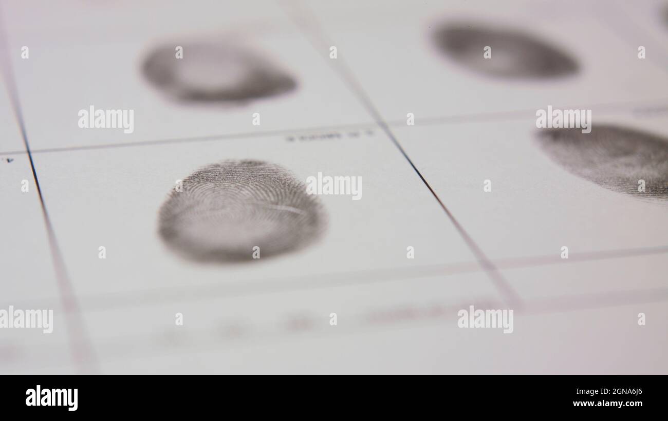 Close up macro of fingerprint registration form filling finger ink ...