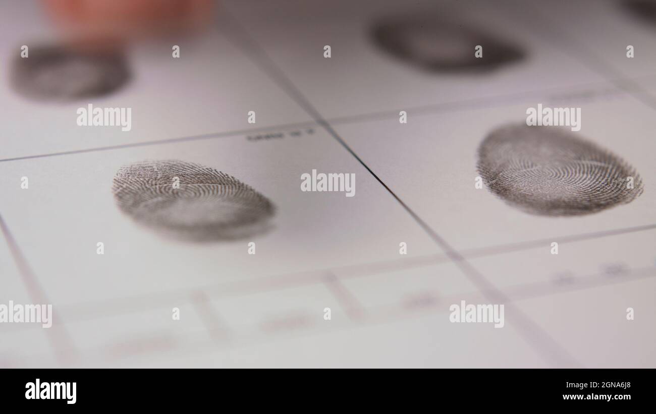 Close up macro of fingerprint registration form filling finger ink ...