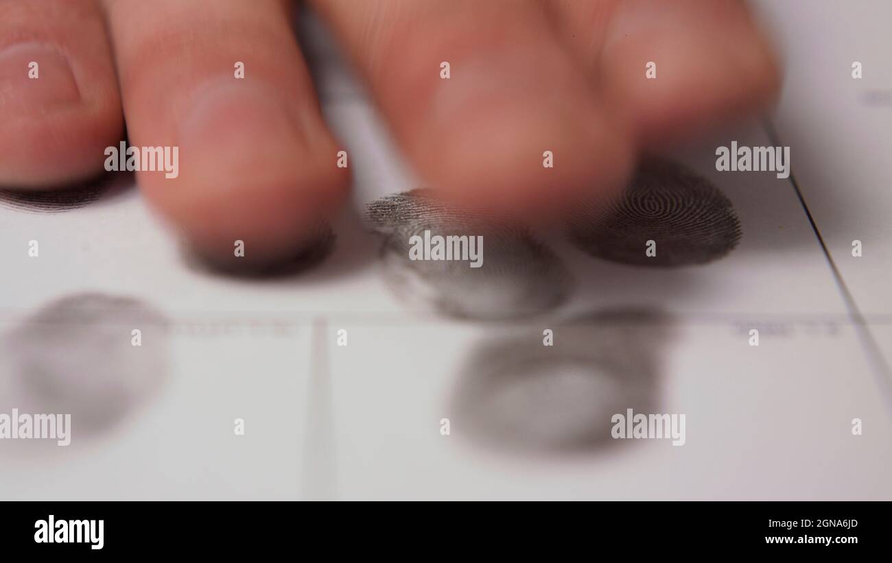 Close up macro of fingerprint registration form filling finger ink ...