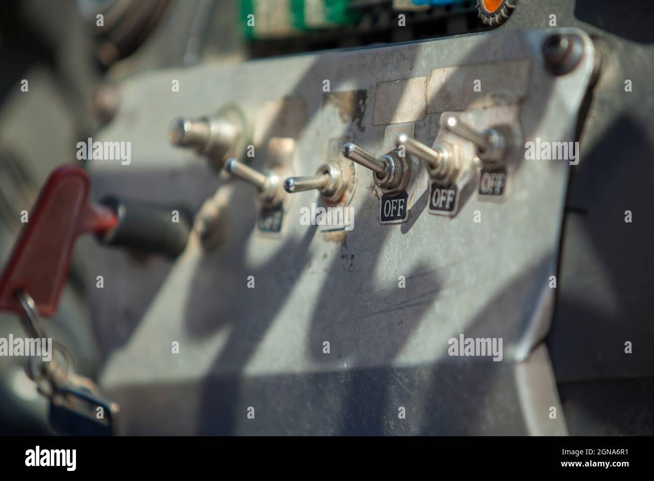 Rally car dashboard switches gauges and steering wheel close up macro ...