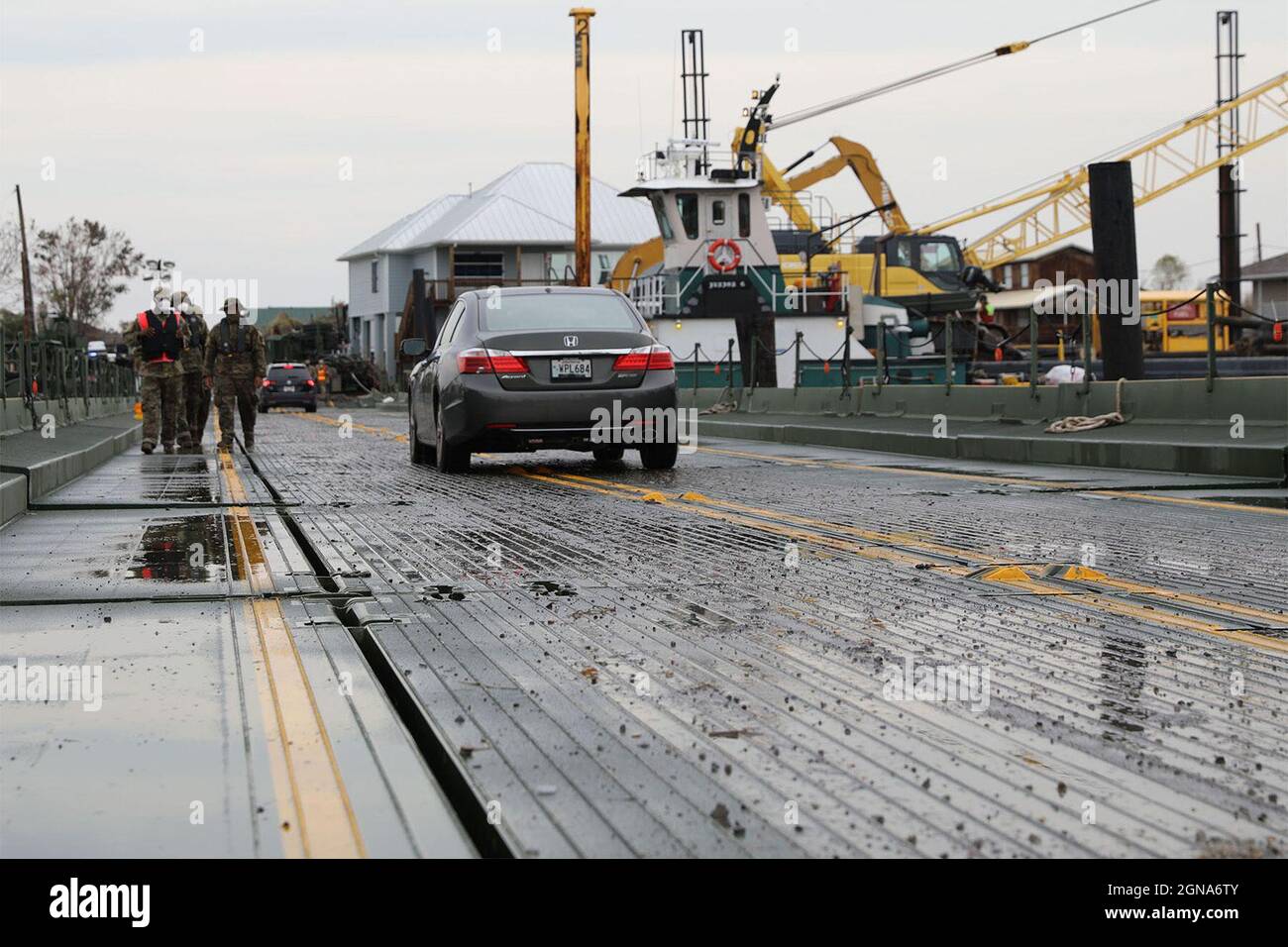 Cars cross an Improved Ribbon Bridge after Hurricane Ida in Jean ...