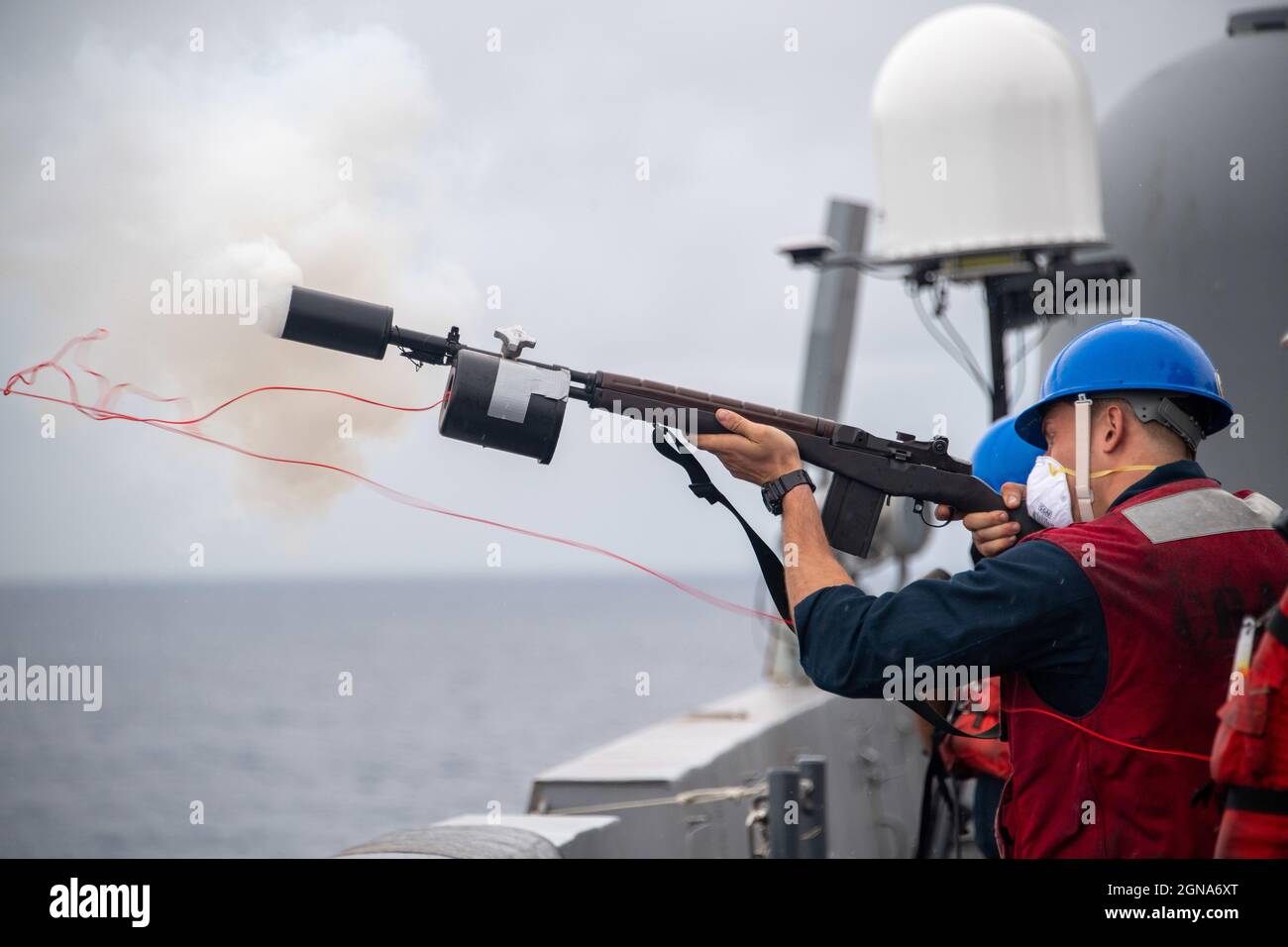 PACIFIC OCEAN (September 3, 2021) — A Sailor fires a messenger line ...