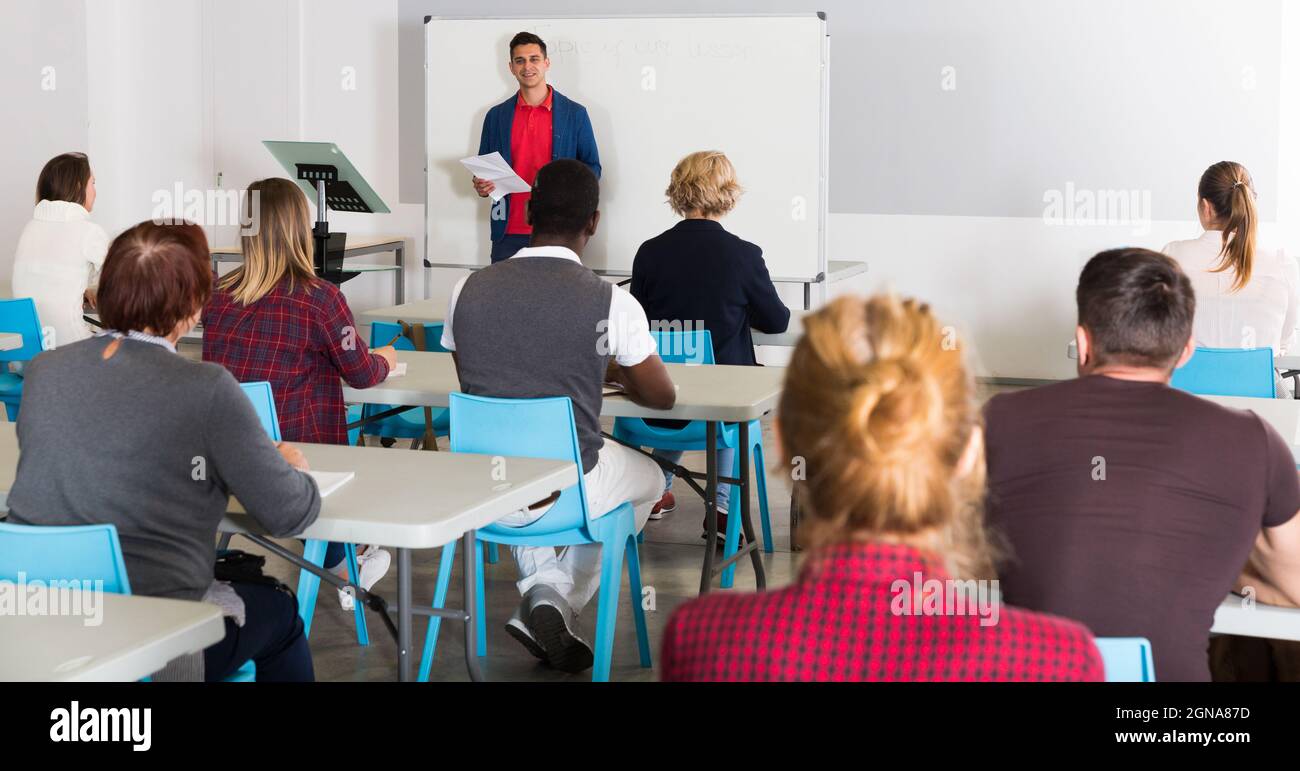 Male teacher lecturing to students Stock Photo - Alamy
