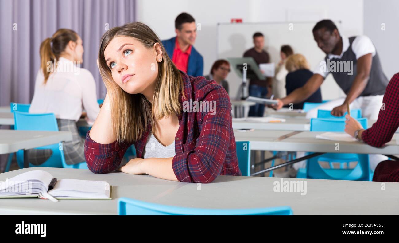 Unhappy girl student in class Stock Photo - Alamy