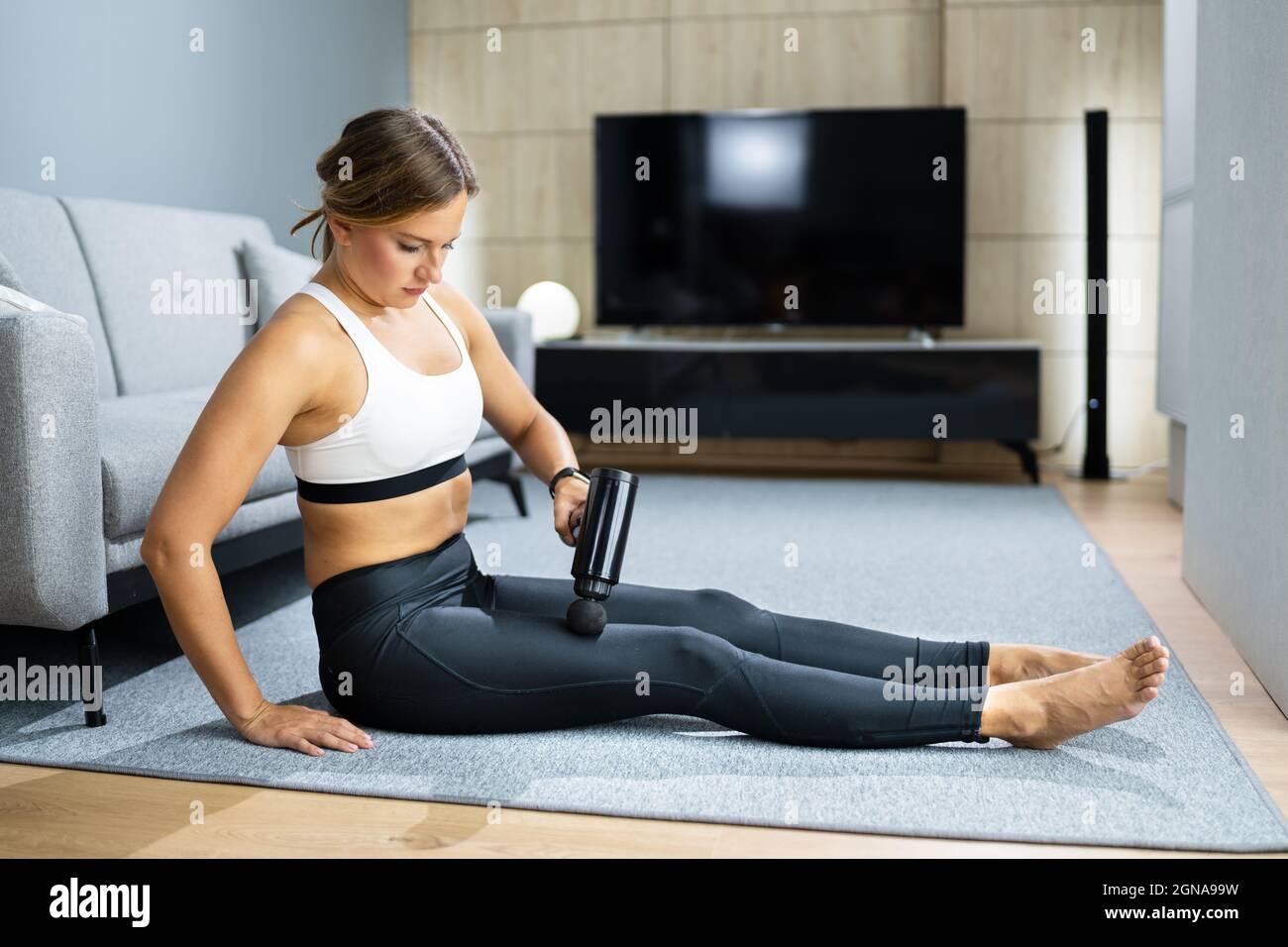 Massage Gun Machine Recovery Therapy And Stimulation Stock Photo - Alamy