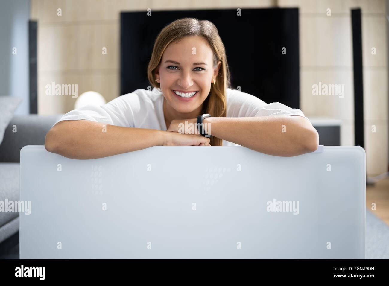 Happy Warm Woman Indoors Near Radiator Heater Stock Photo - Alamy