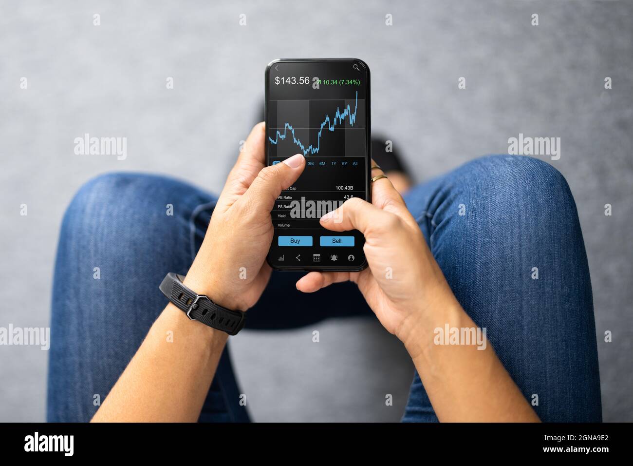 Woman Using Stock Trading App On Mobile Phone Stock Photo - Alamy