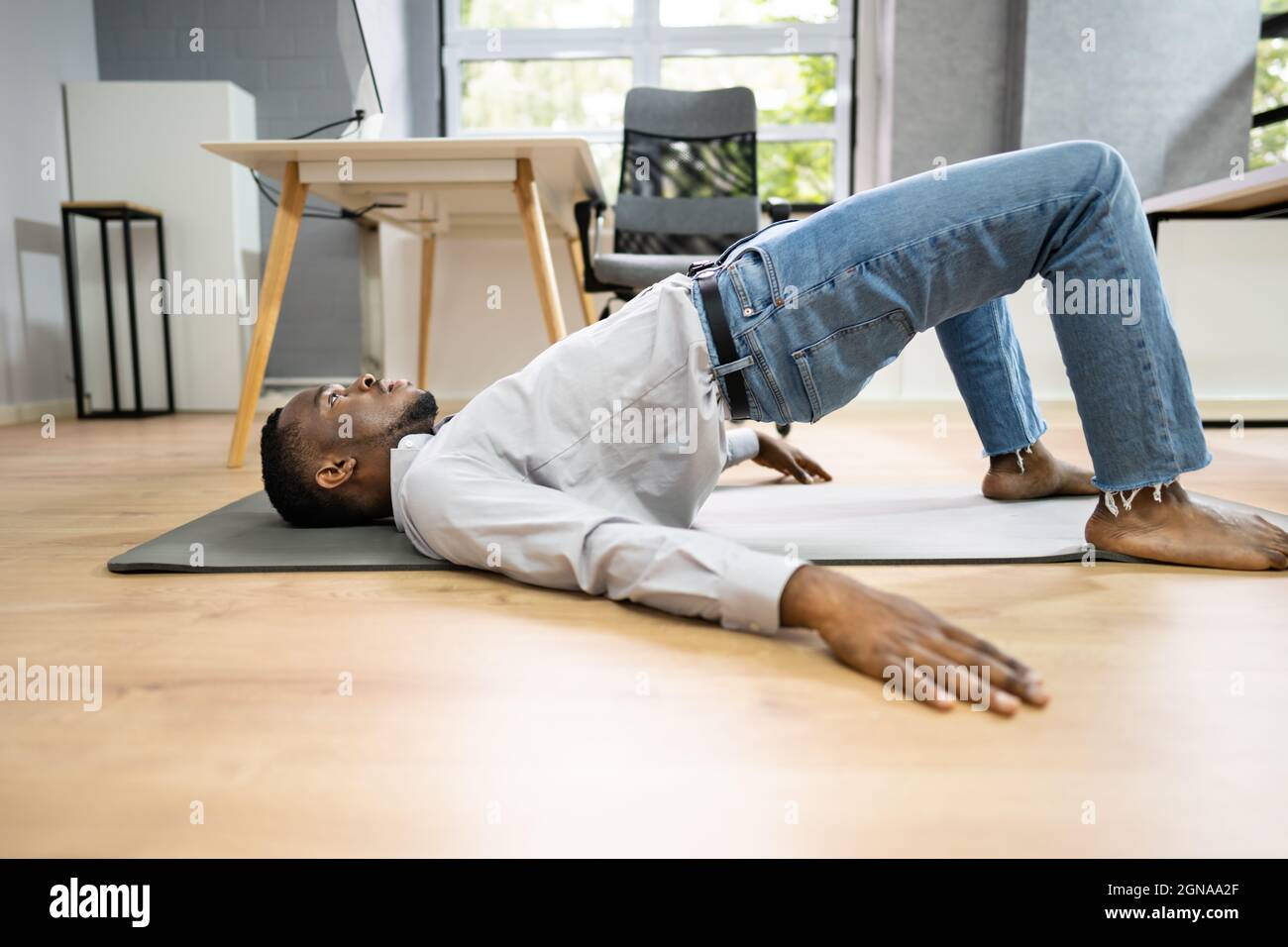African American Doing Office Exercise Workout Training Stock Photo - Alamy