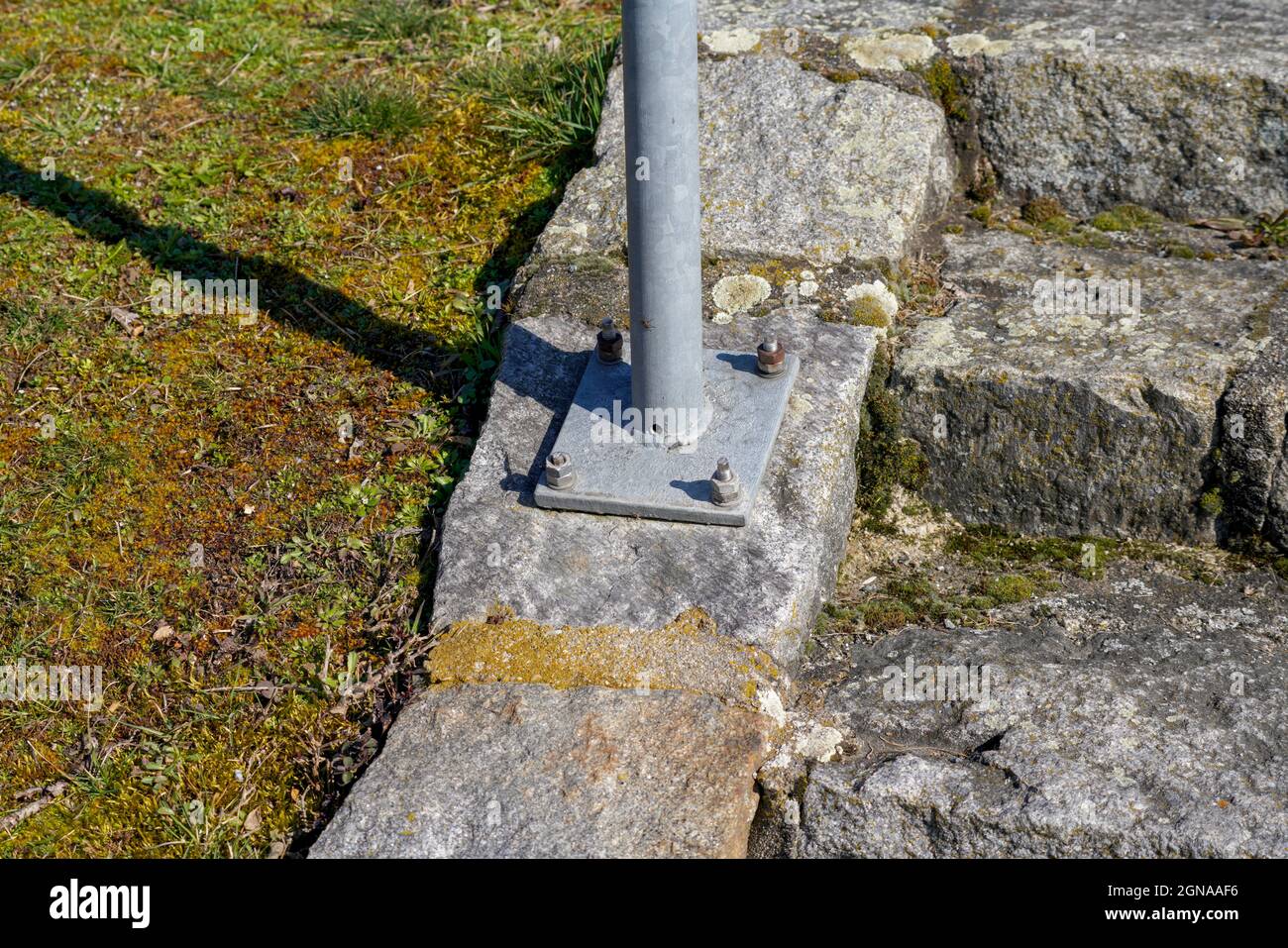 High angle shot of the ground with grass lawn and stairs with a steel ...