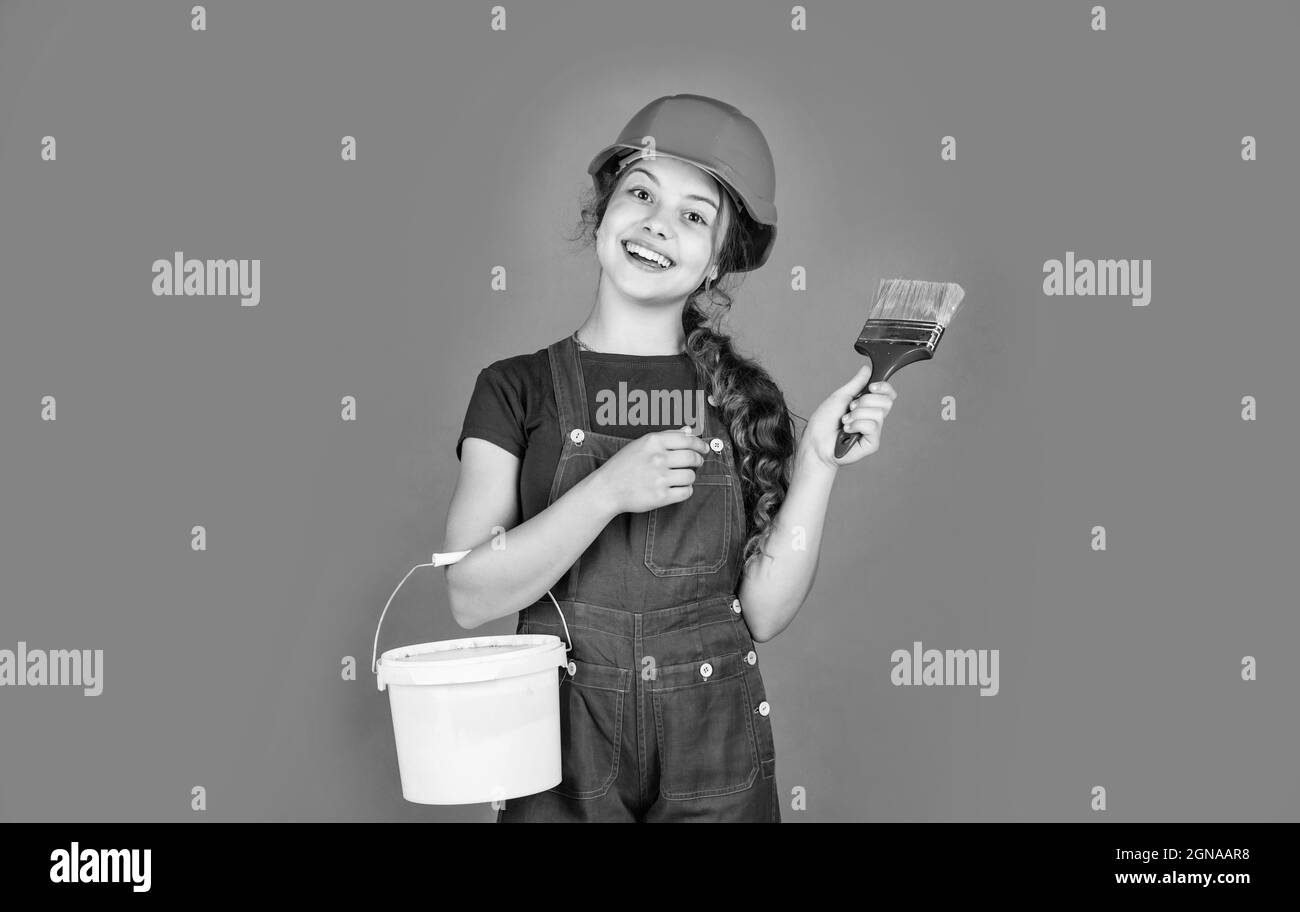 Confident worker. future engineer. happy kid use painting bucket and ...