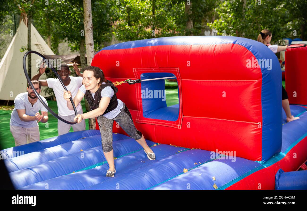 Competition of two women - who quickly throw a hoop on a stick Stock ...