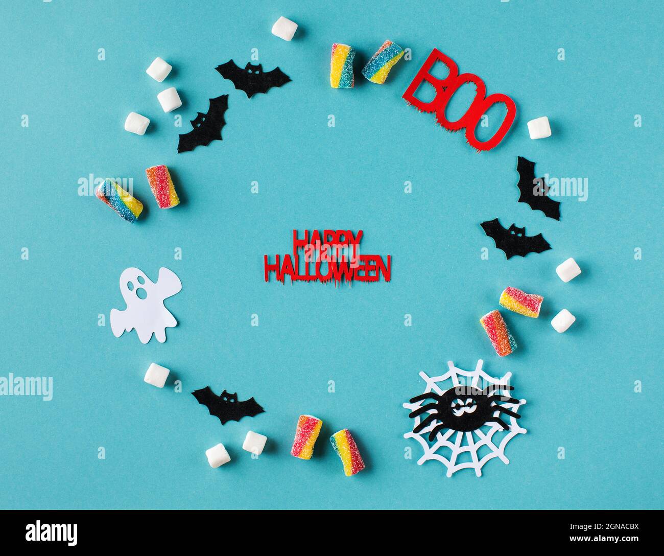 Words Happy Halloween in frame of treats and funny festive symbols on ...