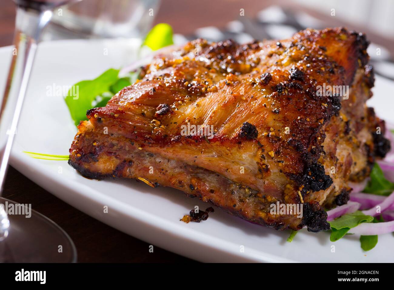 Rack of pork with greens Stock Photo - Alamy