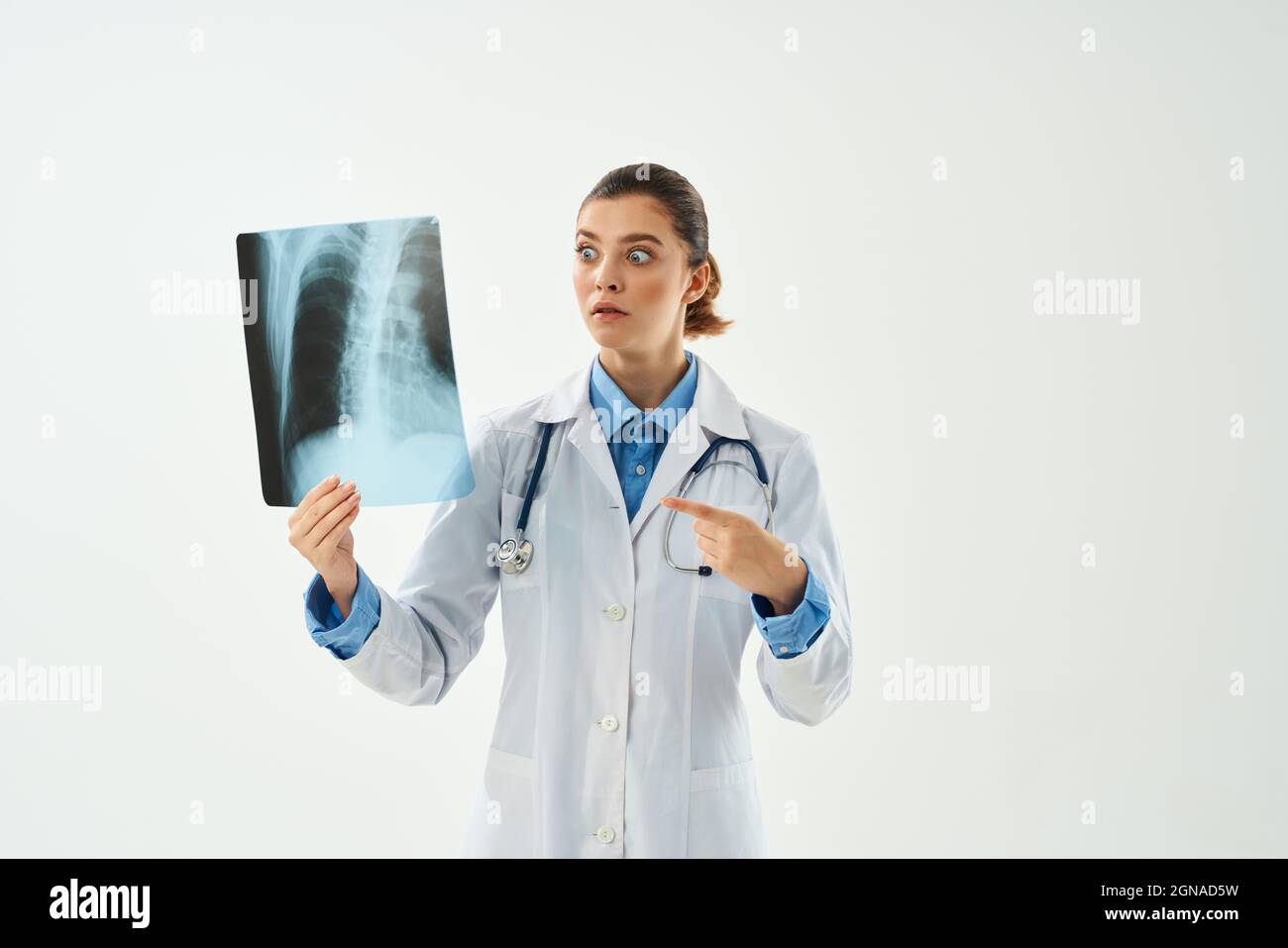 surprised radiologist showing x-ray emotion light background Stock ...