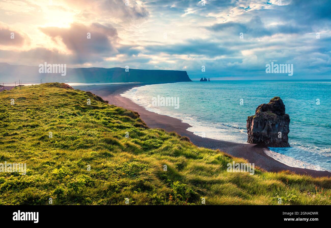 Cloudy summer view of Kirkjufjara beach. Beautiful outdoor scene with ...