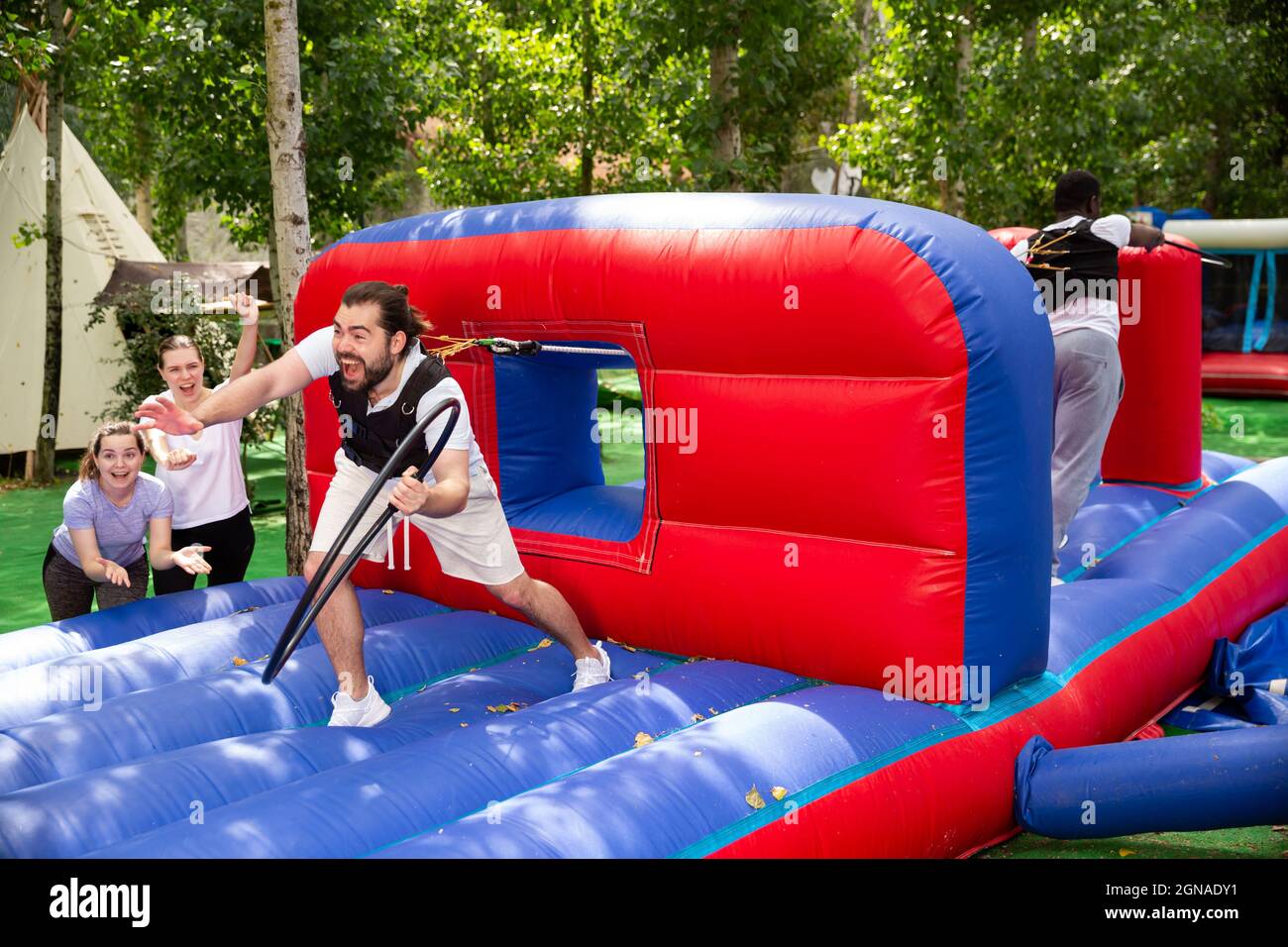 Competition of two men - who quickly throw a hoop on a stick Stock ...