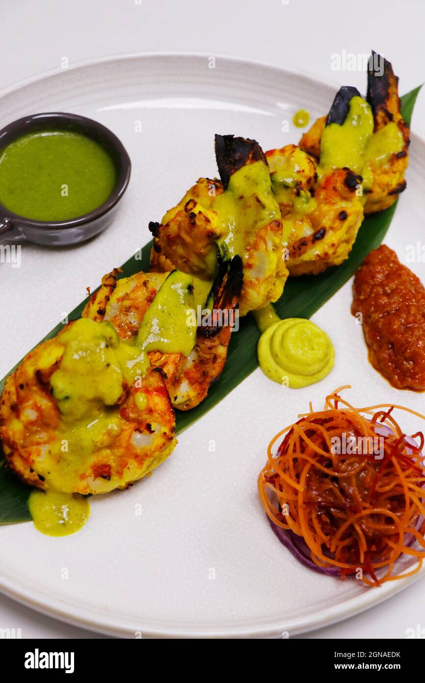 indian clay oven roasted saffron and yoghurt marinated shrimps or ...