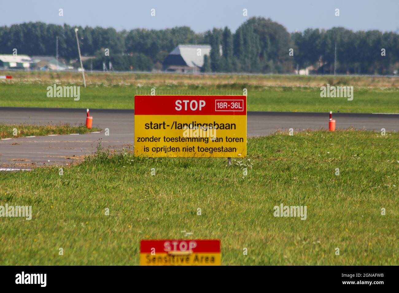 Stop sign at landing strip 38R-16L at Amsterdam Schiphol Airport in the ...