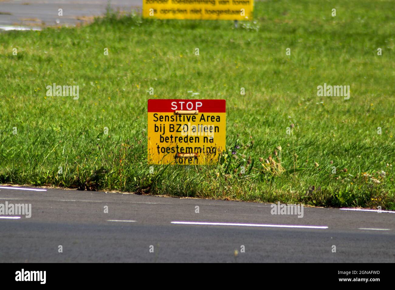 Stop sign at landing strip 38R-16L at Amsterdam Schiphol Airport in the ...