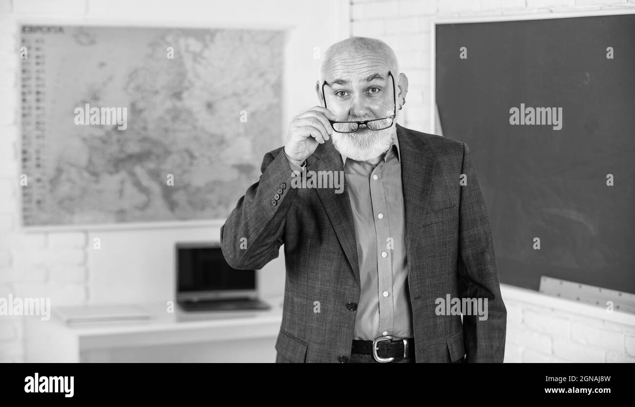 More tools introduced into everyday classrooms. Senior man teacher at ...