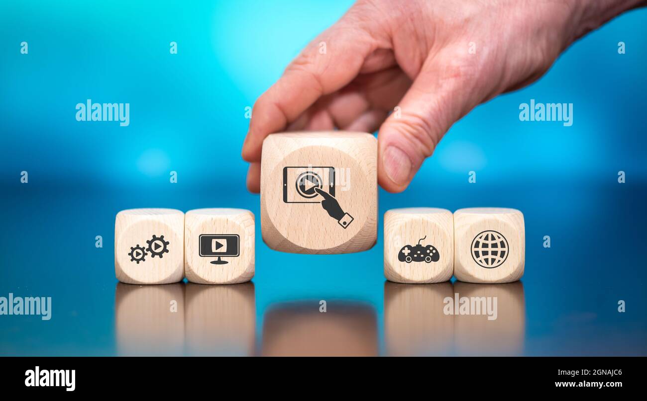 Wooden blocks with symbol of online streaming concept on blue ...