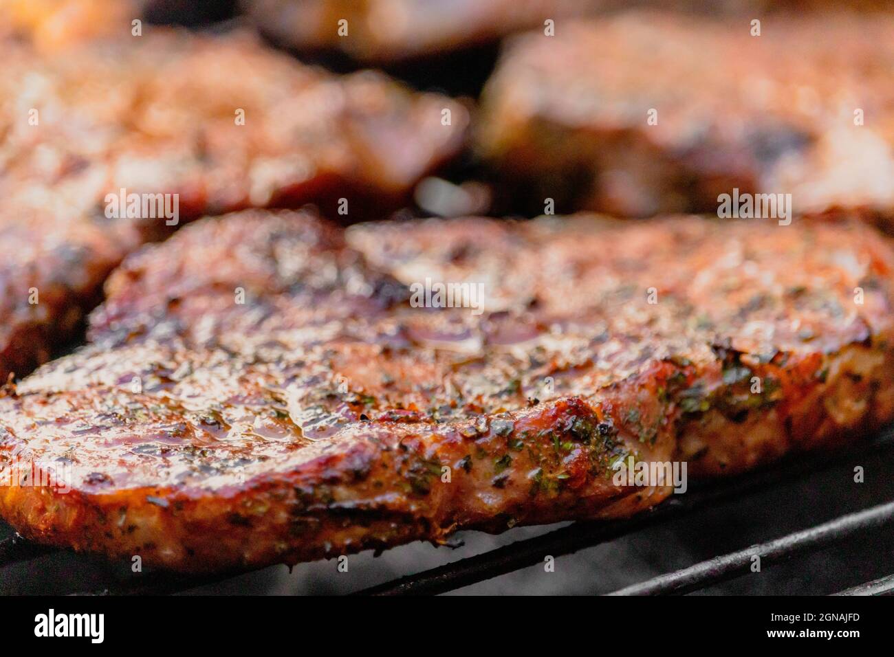 Meat on gas grill hi-res stock photography and images - Alamy