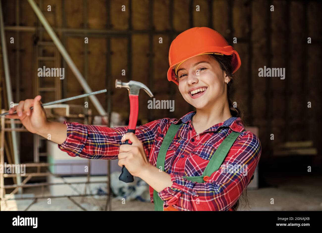 engineering education. future engineer. happy kid use hammer repairing ...