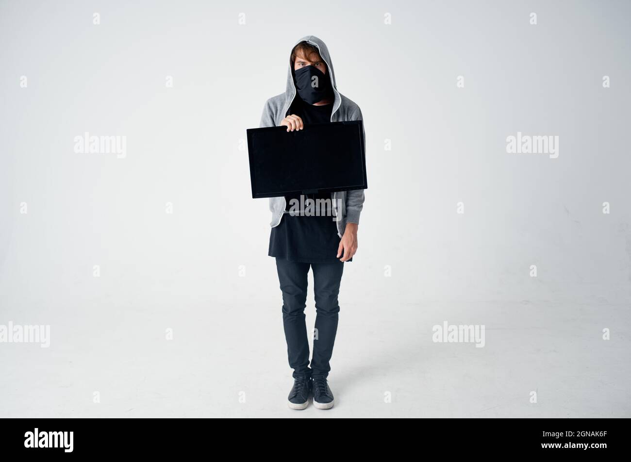 male thief hooded head hacking technology security isolated background ...