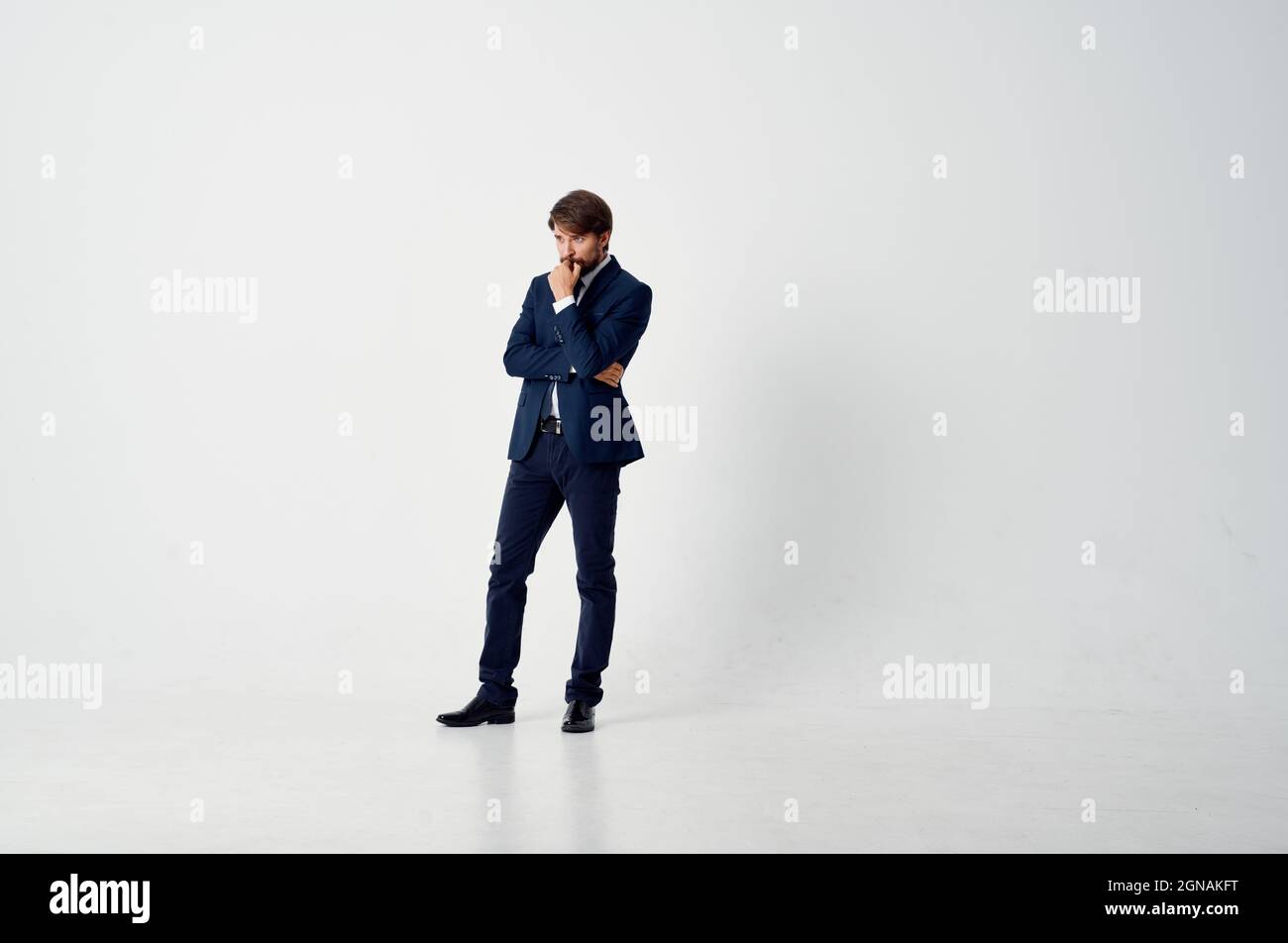businessmen posing executive light background Stock Photo - Alamy