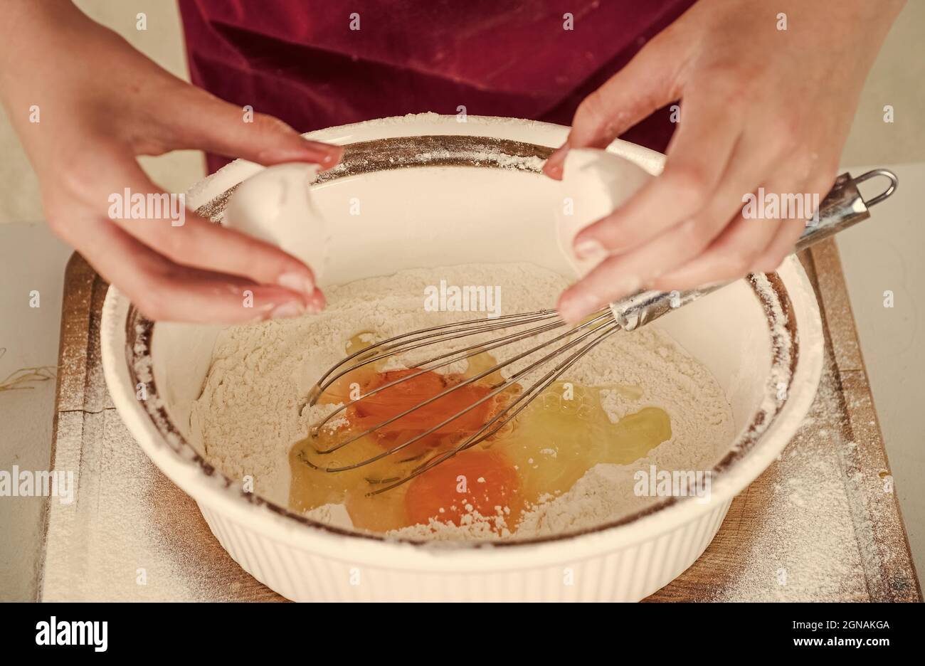 girl beating egg and flour for making dough with beater, cooking Stock ...