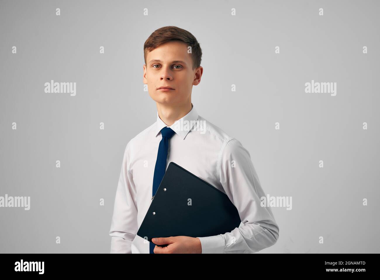 manager in a white shirt with a tie black folder documents work posing ...