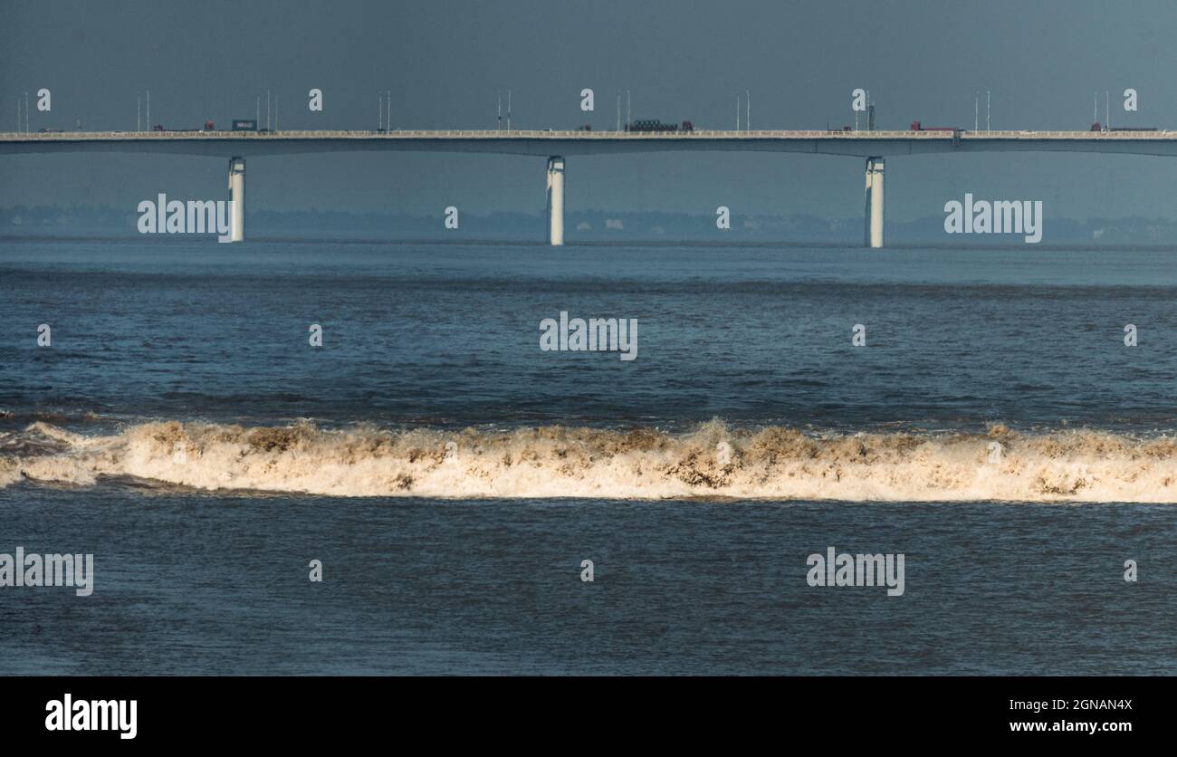 The tide waves are captured at Qiantang River in Hangzhou city, east ...