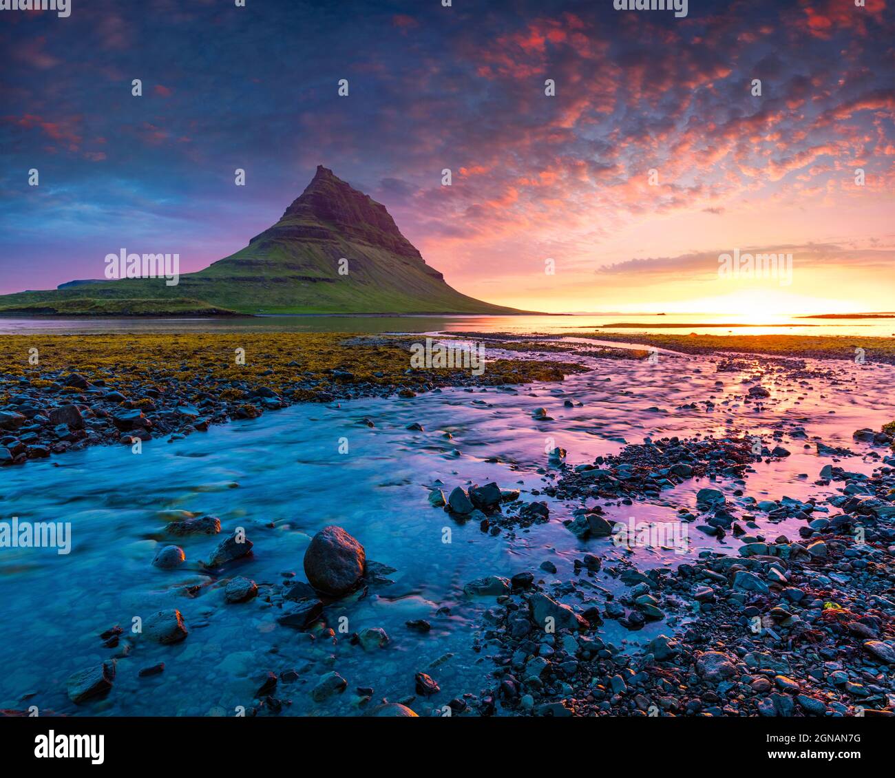 Colorful summer sunset with Kirkjufell mountain. Dramatic scene on ...