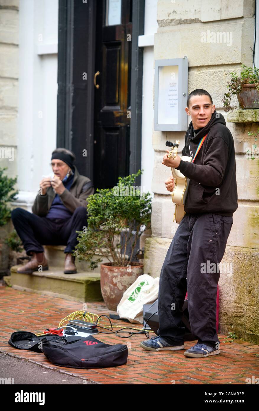 A busker on Threadneedle Street in the town of Stroud in ...