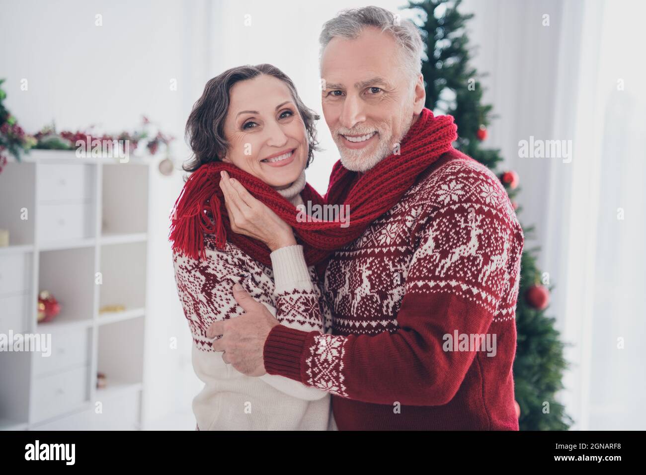 Photo of cute couple aged lady man hug wear sweater scarf at home Stock ...