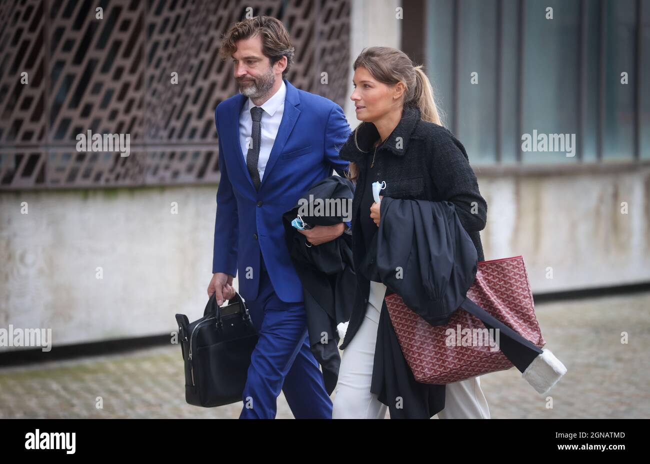 Lawyers arrive for the opening session of the case against 18 members ...