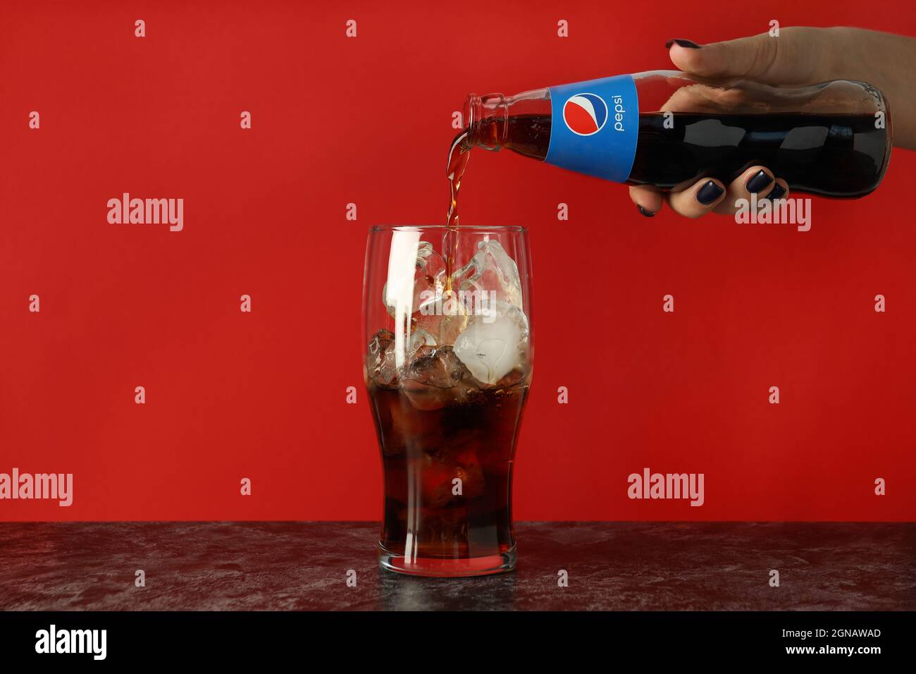Odessa, Ukraine - September 23, 2021: Female hand pour Pepsi from ...