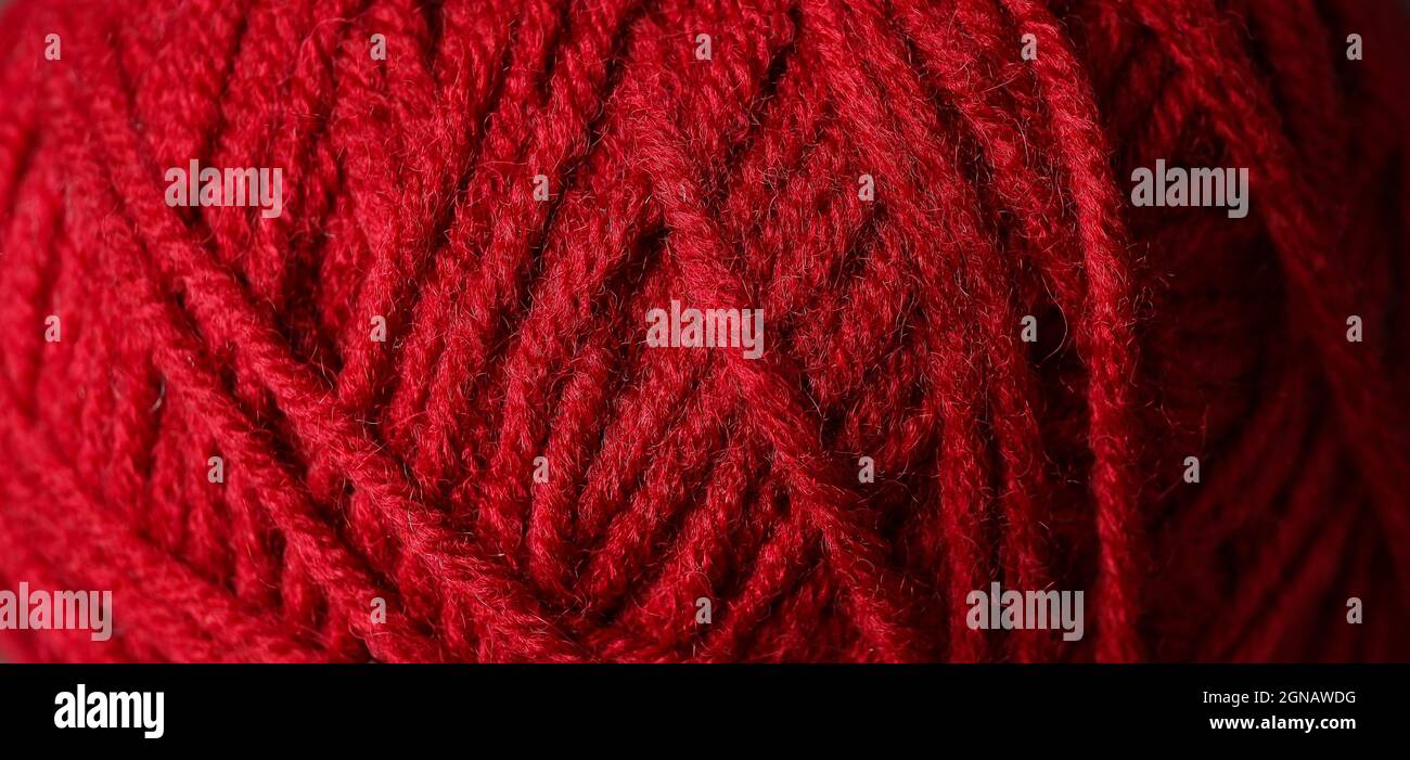 Red ball of yarn all over background, closeup Stock Photo - Alamy