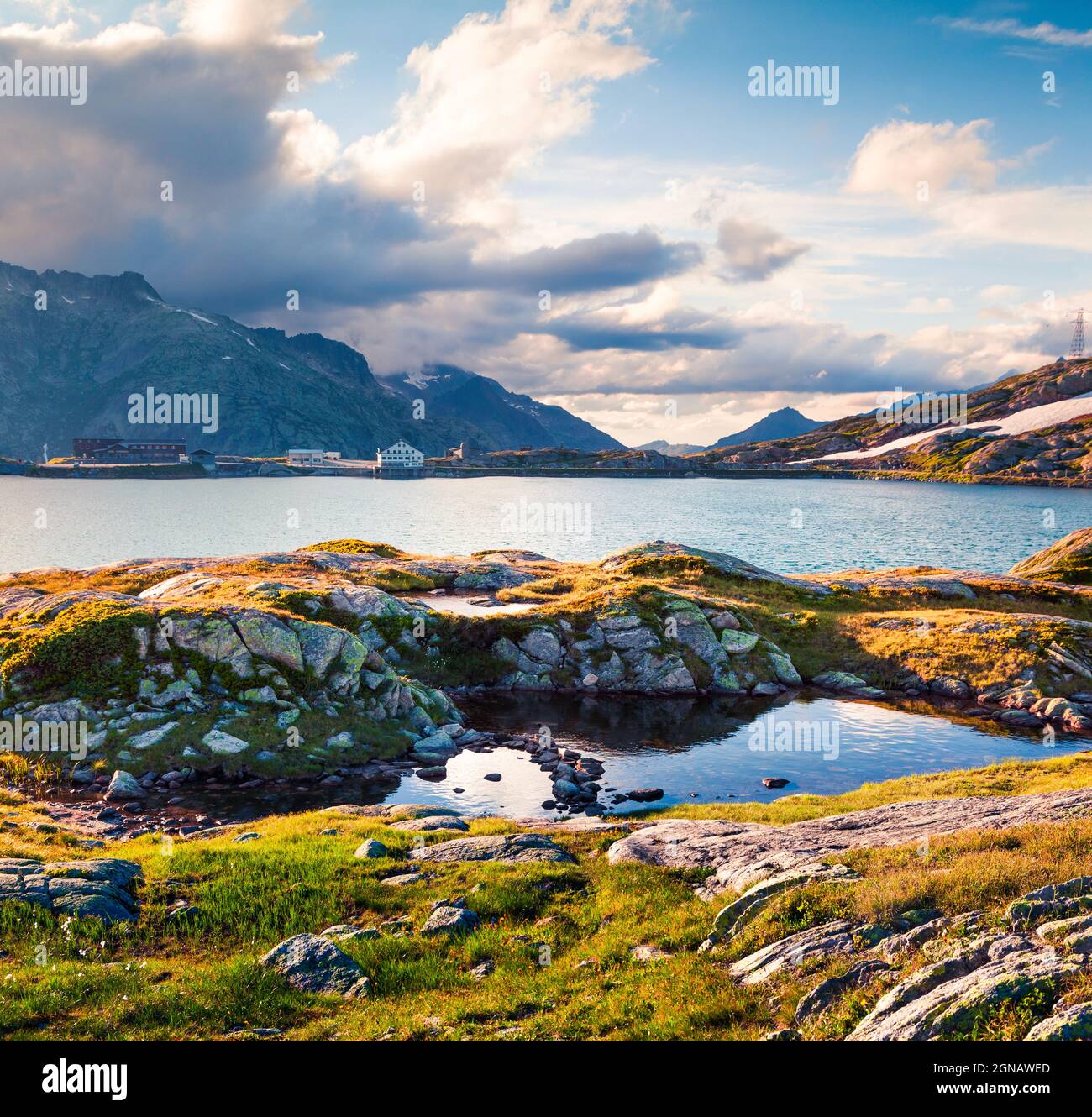 Colorful summer evening on the Totensee lake on the top of Grimselpass ...