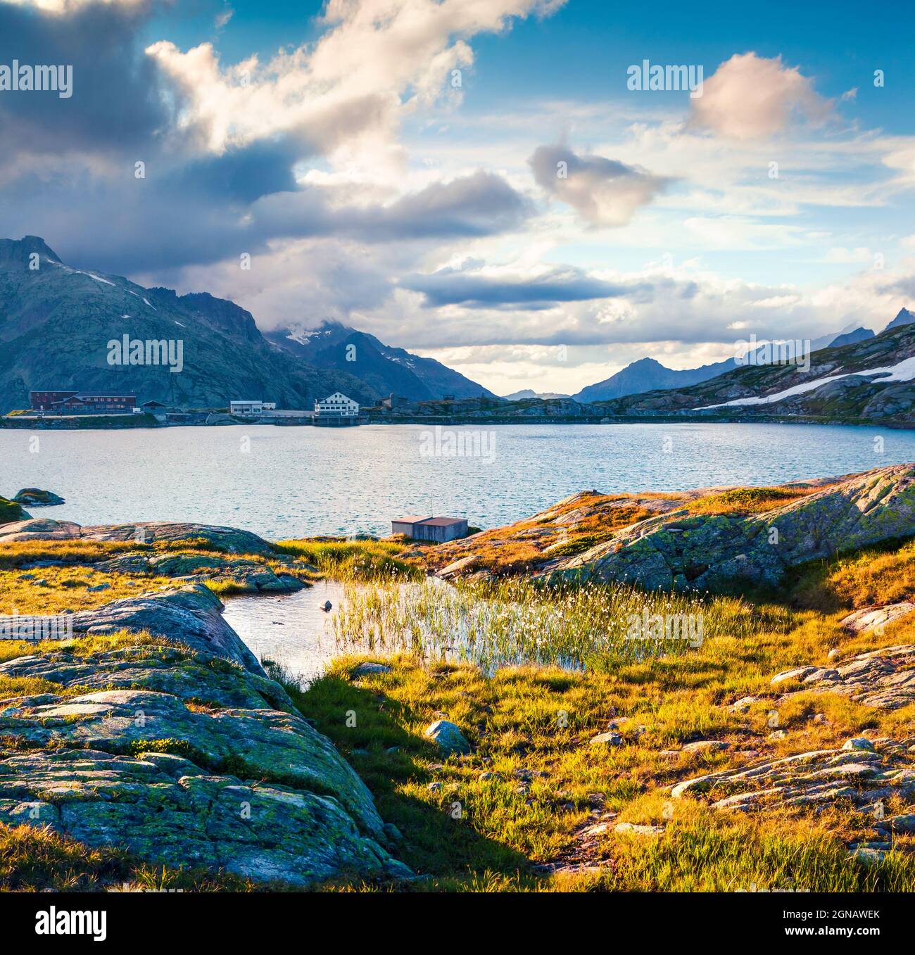 Colorful summer evening on the Totensee lake on the top of Grimselpass ...