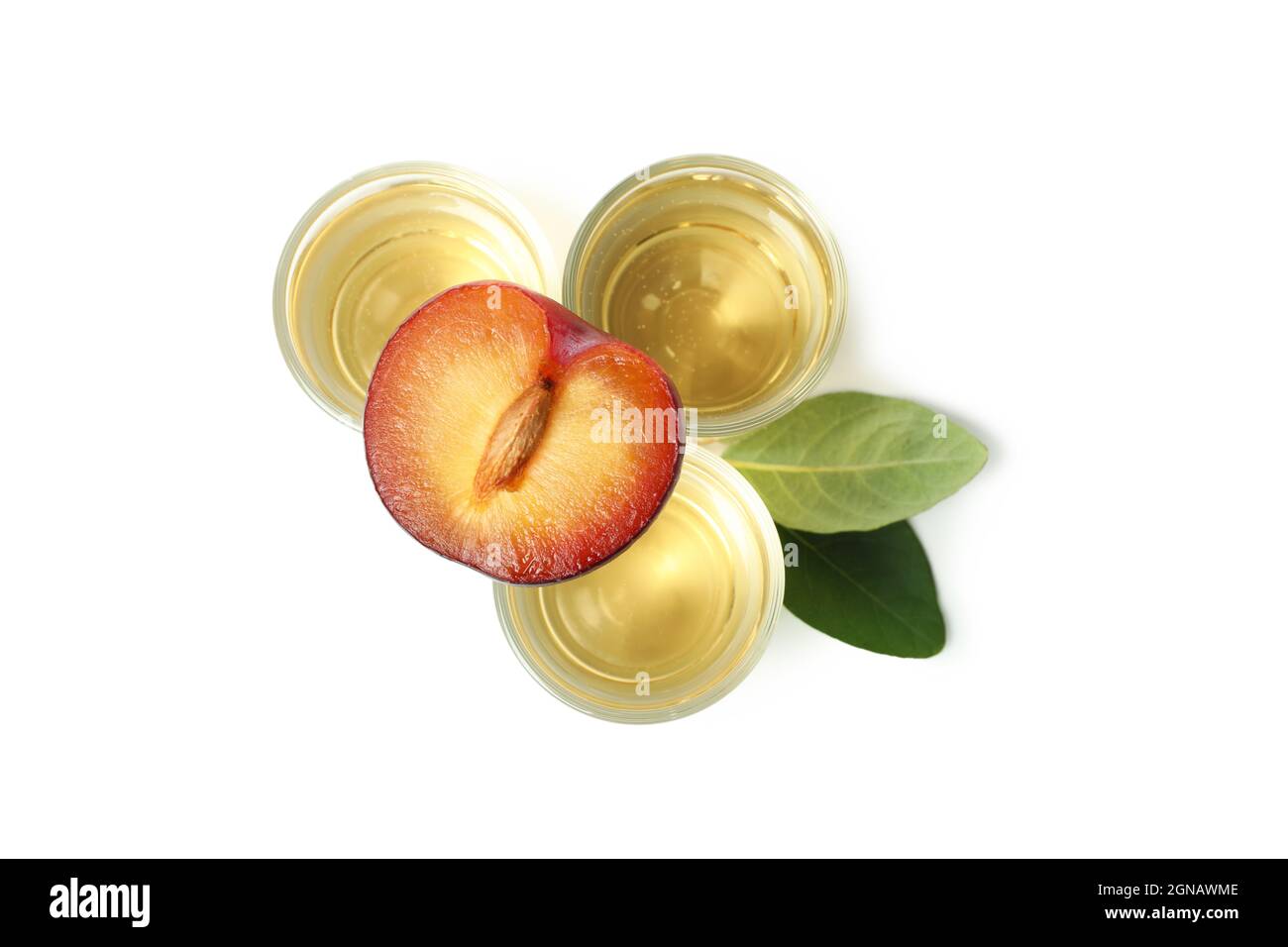 Plum vodka shots isolated on white background Stock Photo - Alamy