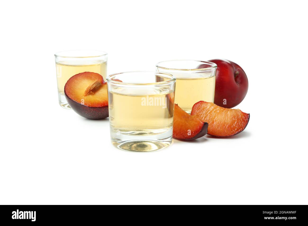 Plum vodka shots isolated on white background Stock Photo - Alamy