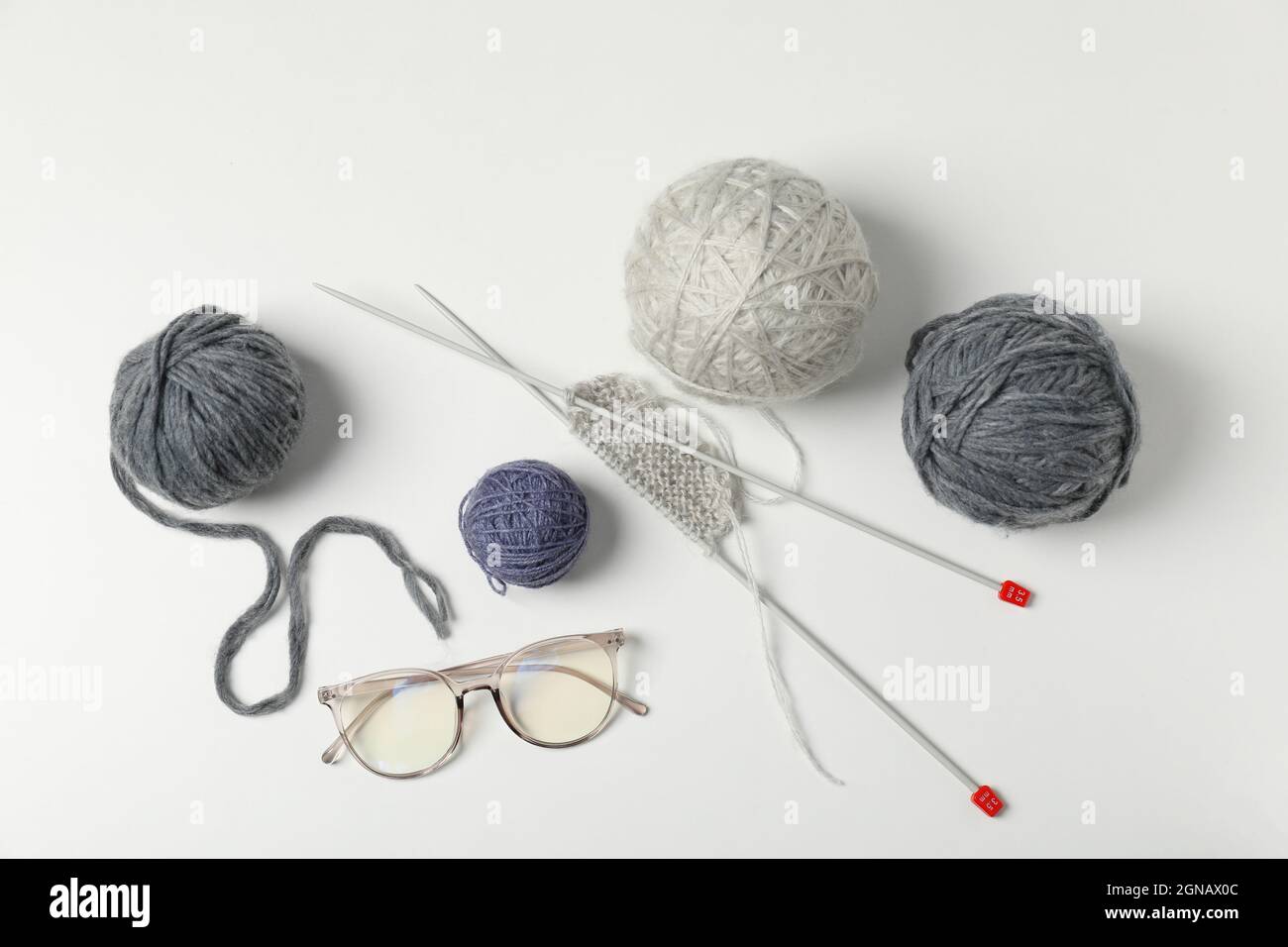 Concept of knitting on white background, top view Stock Photo - Alamy