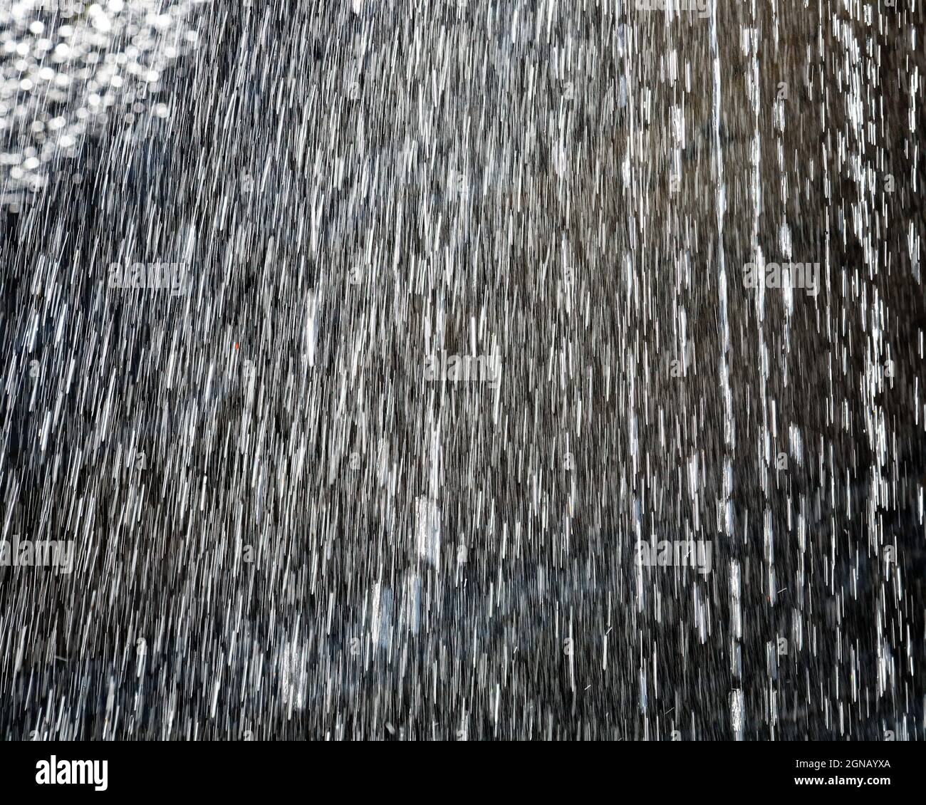 Abstract image of water spraying in slow motion from a waterfall ...